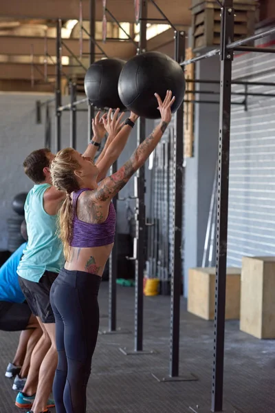 people doing wall ball exercises - Stock Image - Everypixel