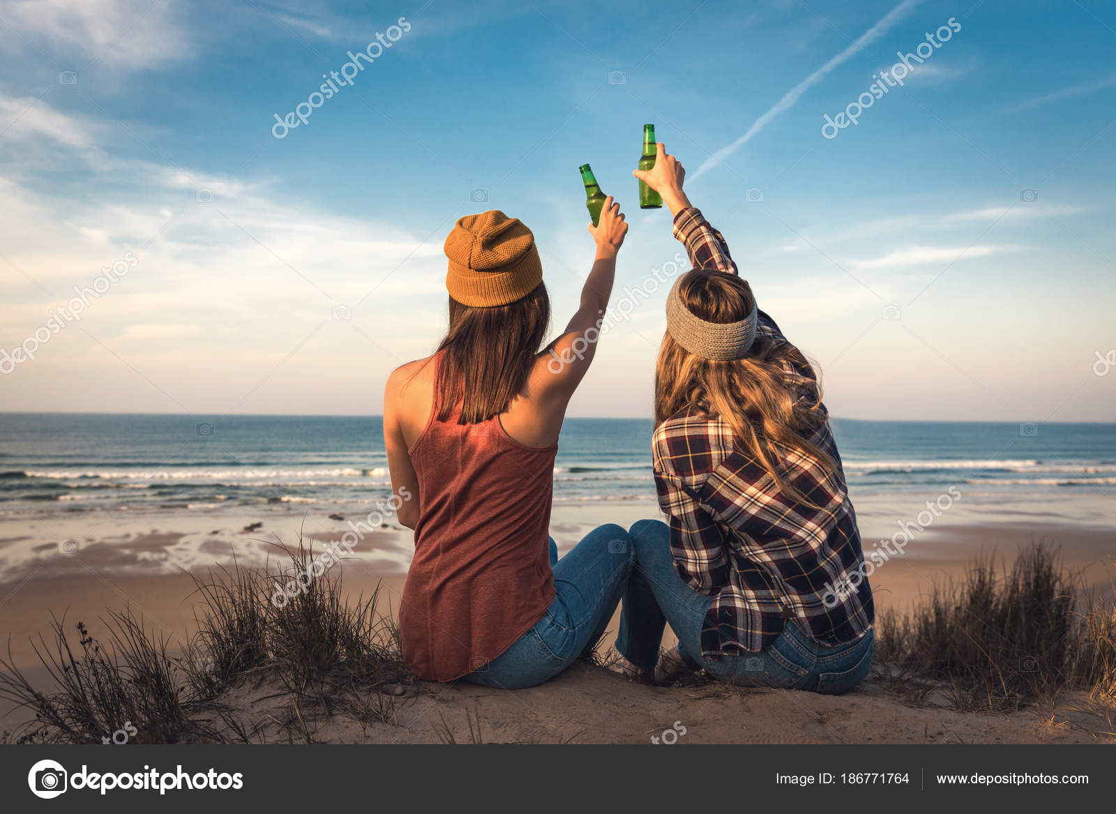 Two Best Friends Holding Hands In The Sunset