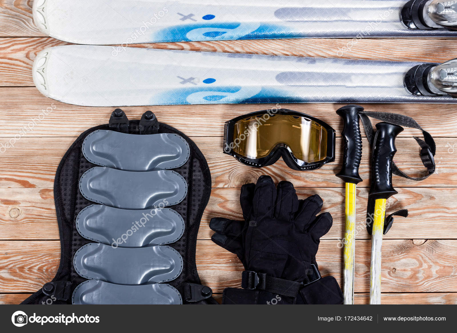 Overhead view of ski accessories placed on rustic wooden table. — Stock ...