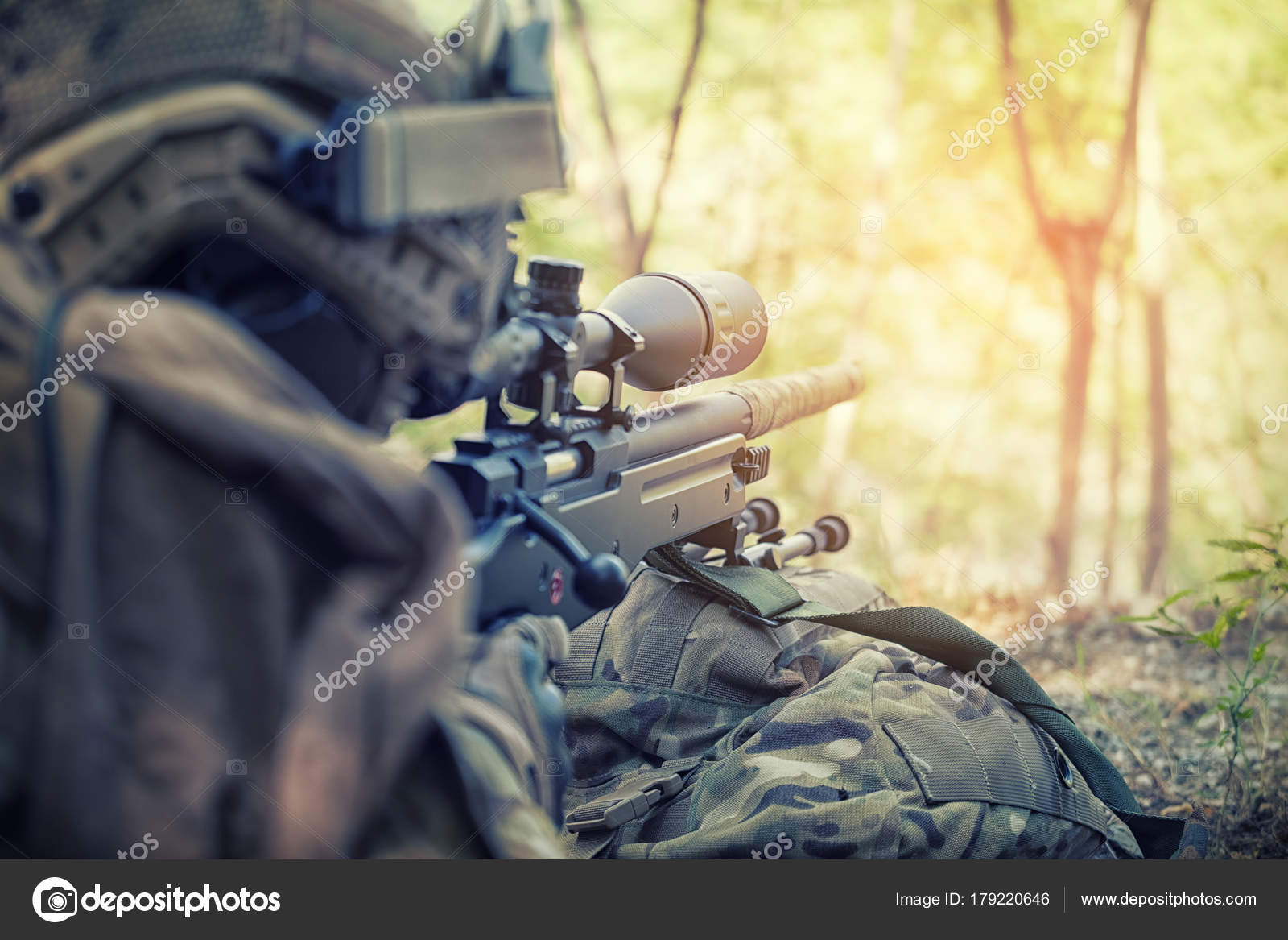 Russian sniper - rear view Sniper with rifle hidden in trench, s ...
