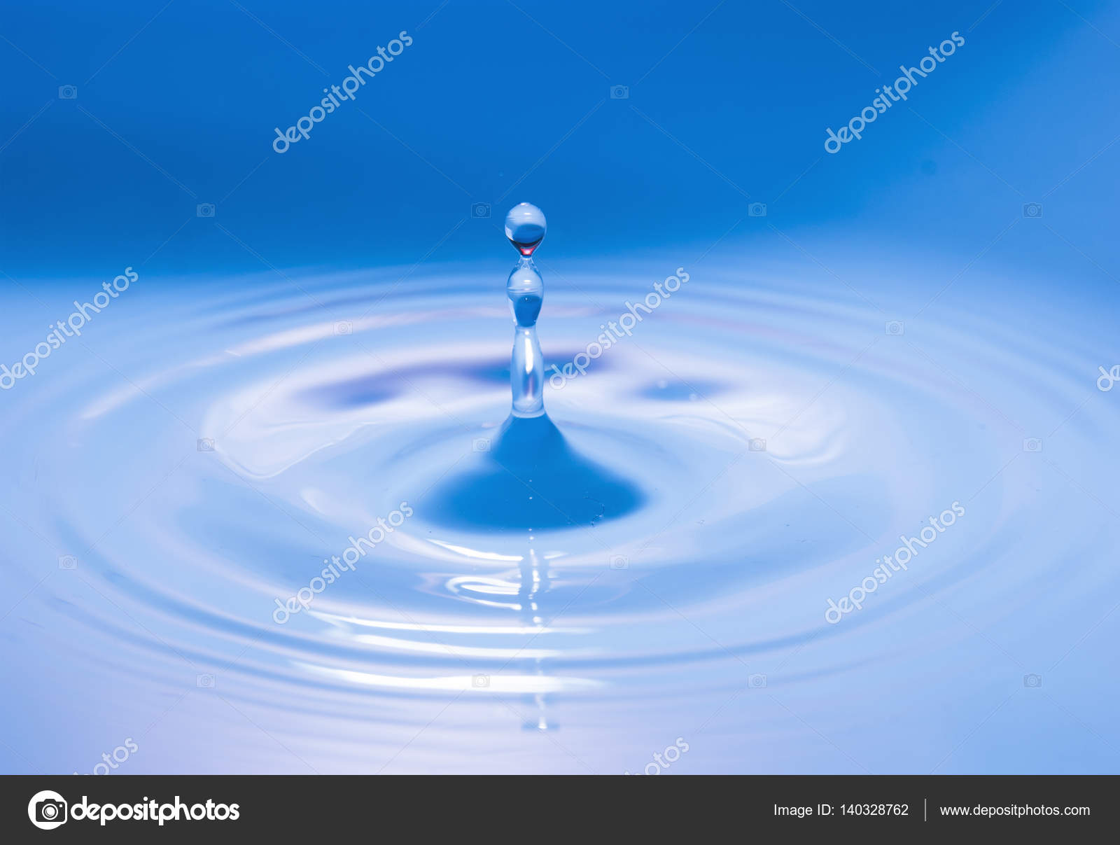 Water drop falling into water — Stock Photo © alan64 #140328762