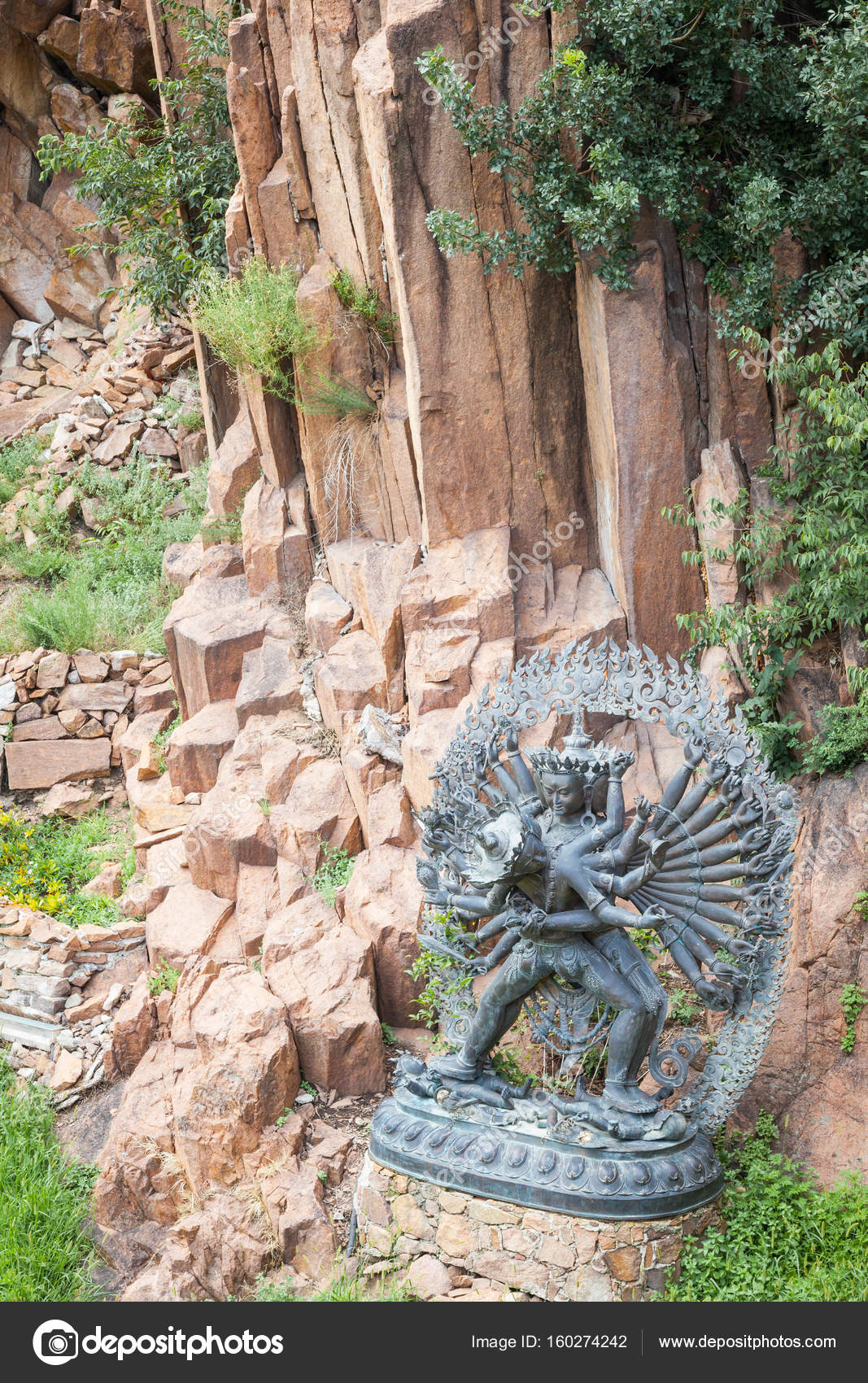 Tantric Deities statue in Ritual Embrace located in a mountain g ...