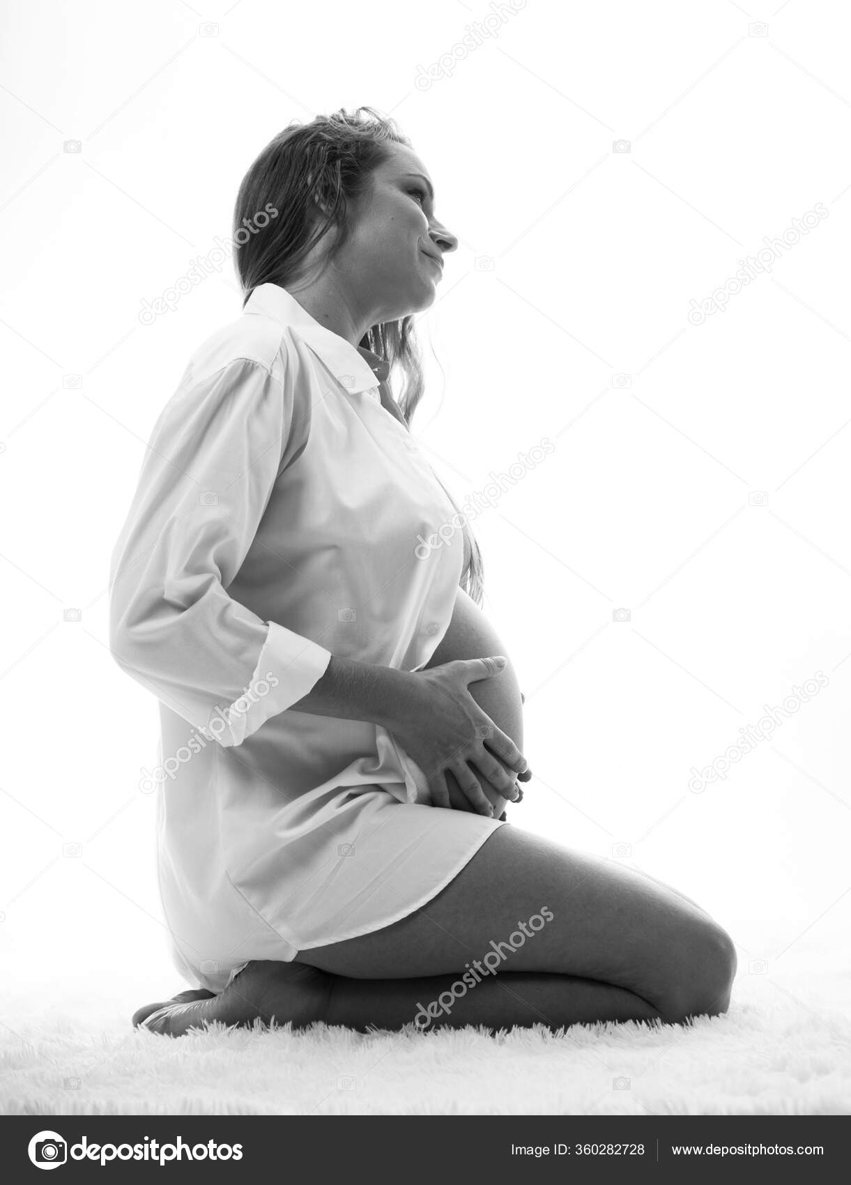 Pretty Pregnant Woman White Shirt Panties Holding Her Belly While Stock