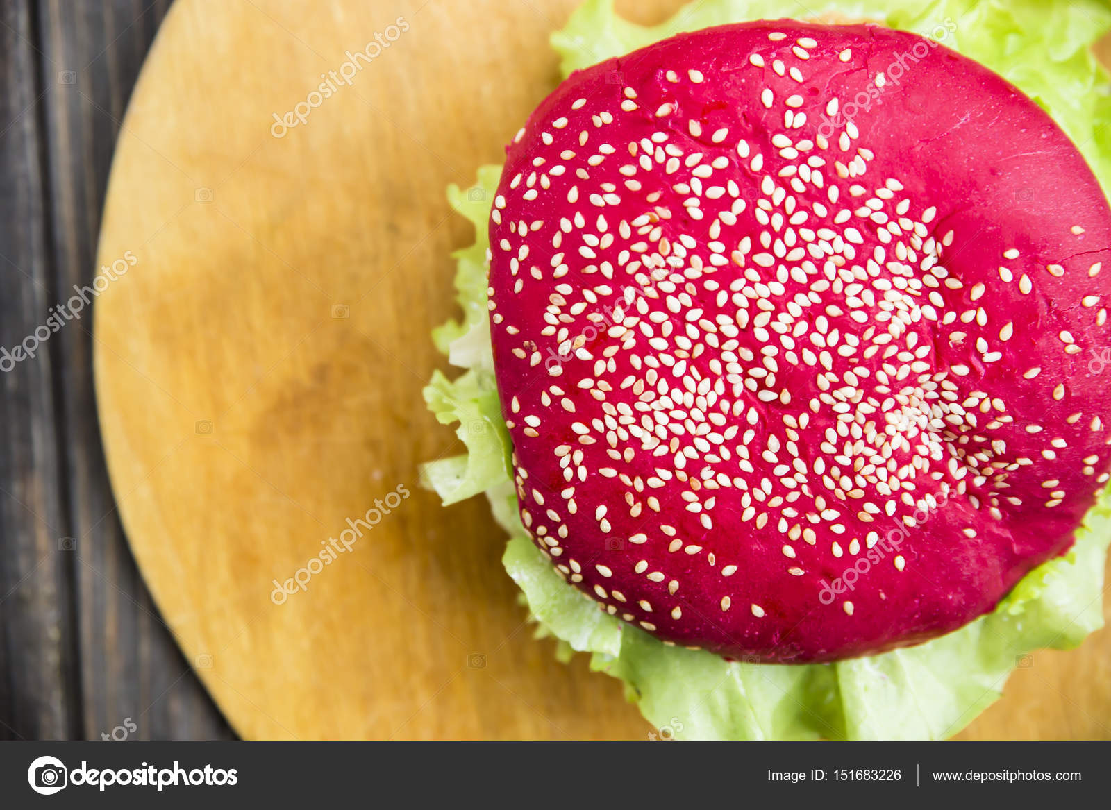 Red burger bun made of beet, with meat and lettuce — Stock Photo ...