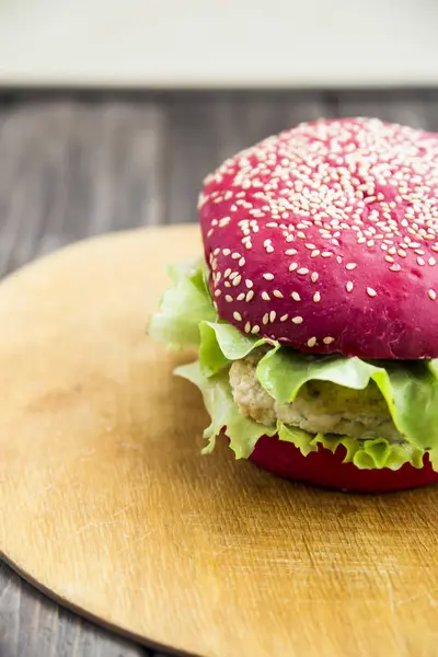 Red burger bun made of beet, with meat and lettuce — Stock Photo ...