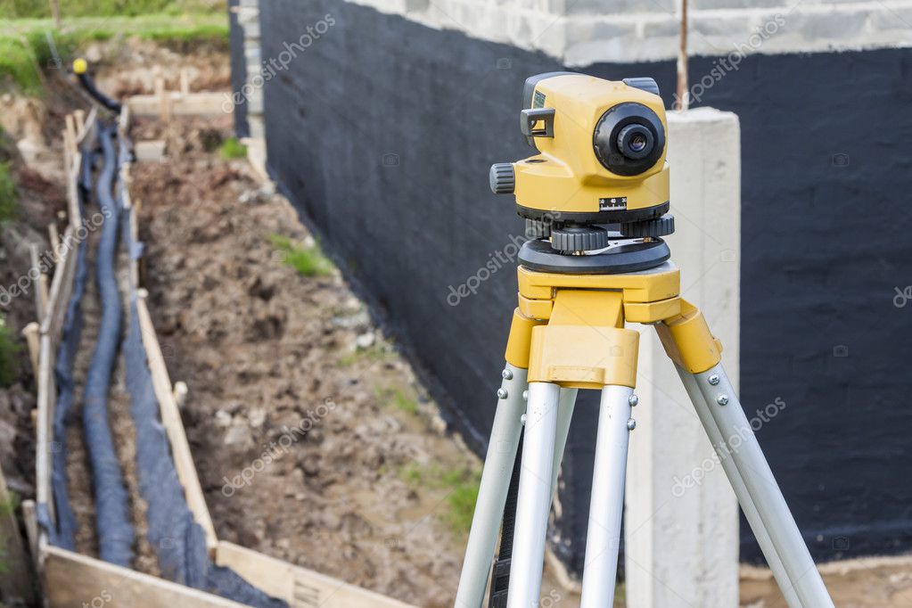 Surveyor equipment optical level at construction site — Stock Photo ...