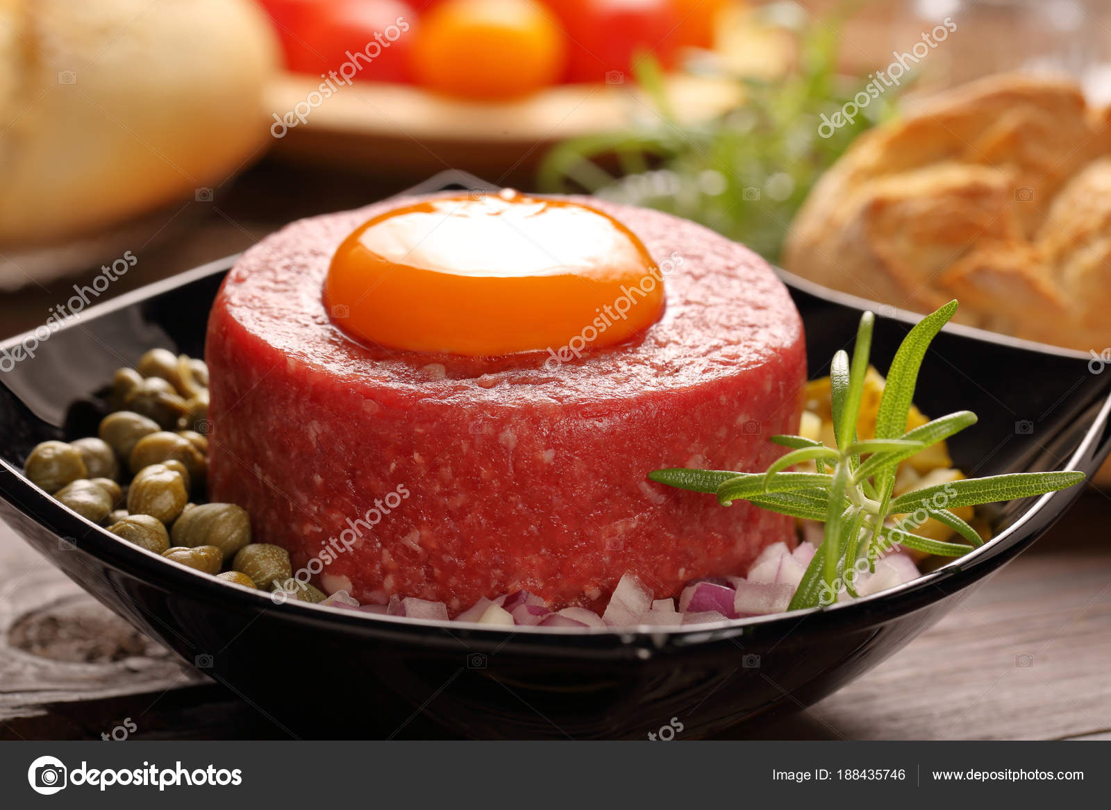 Beef steak tatare with egg, onion, cucumber and capers Stock Photo by ...