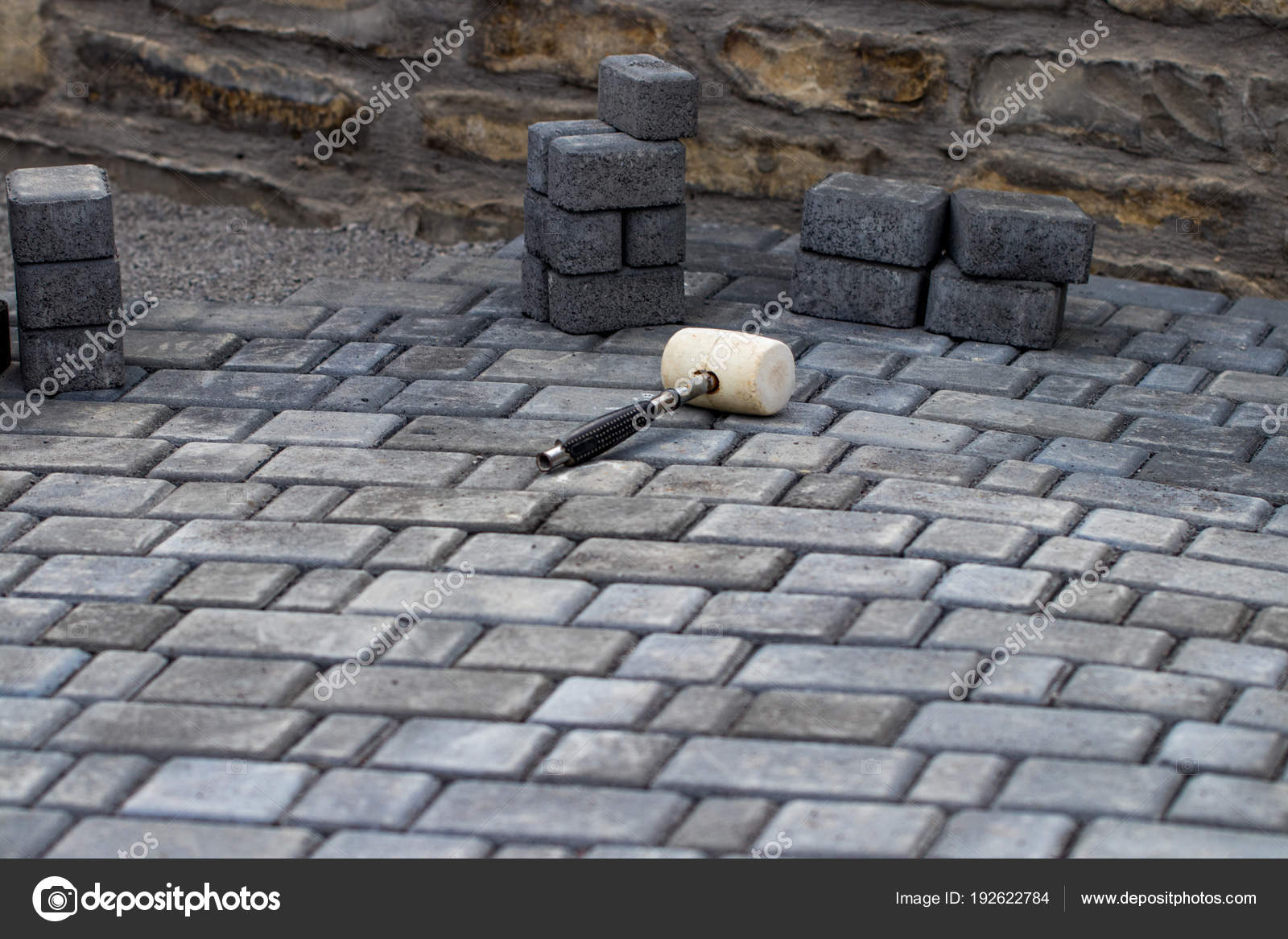 Interlocking paving with gray and white concrete blocks; Concret ...