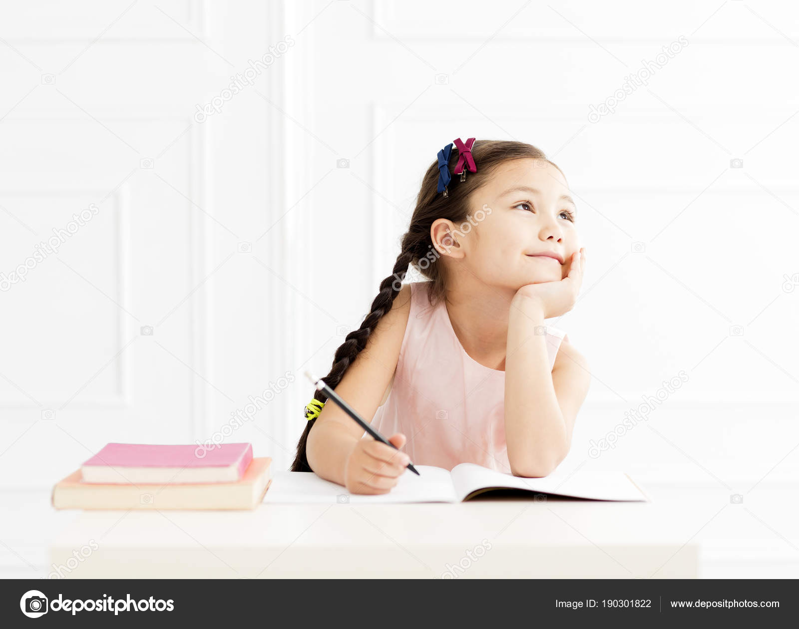 Happy Little Girl Studying Thinking Stock Photo by ©tomwang 190301822