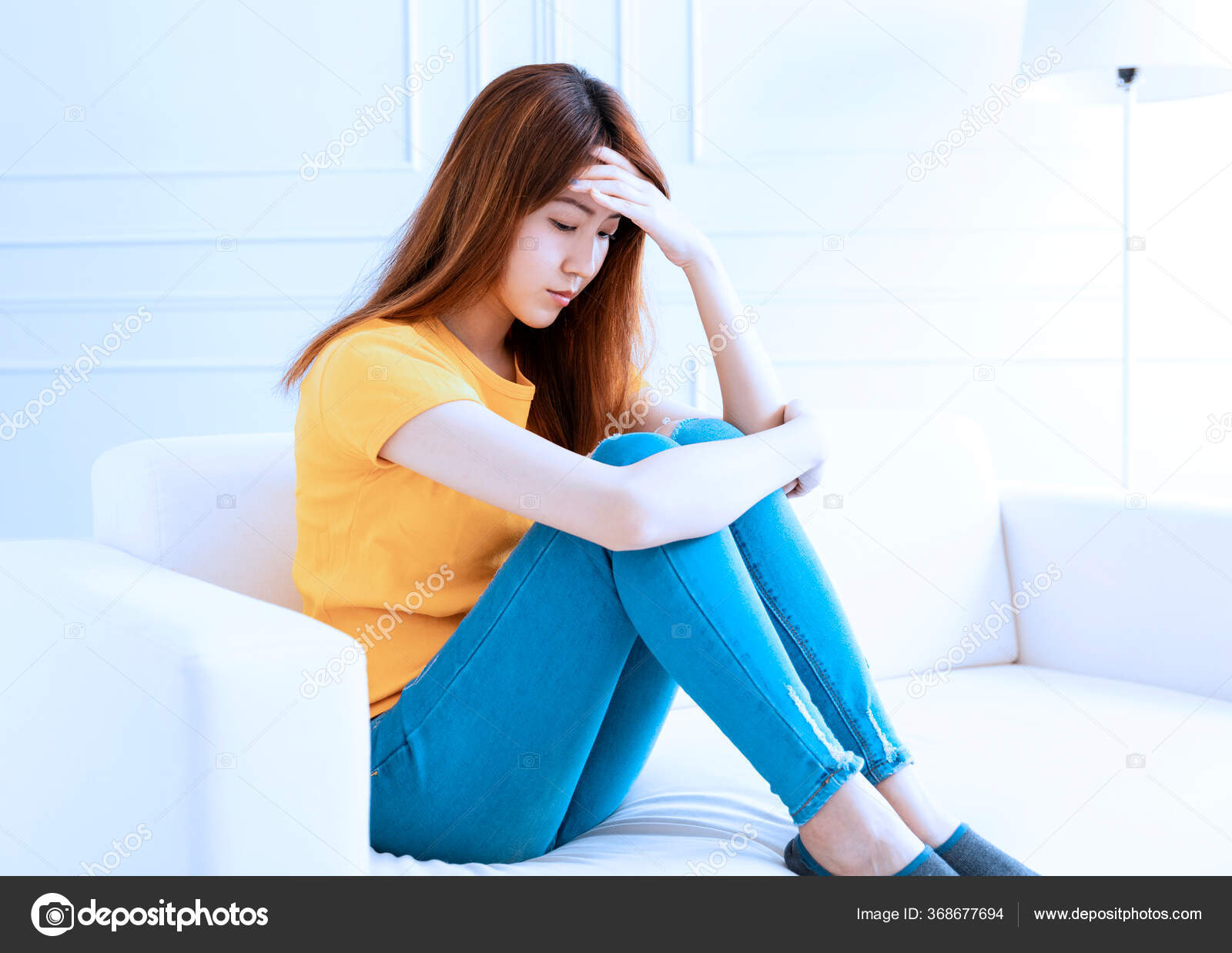 Sad Young Woman Sitting Sofa Home — Stock Photo © tomwang #368677694