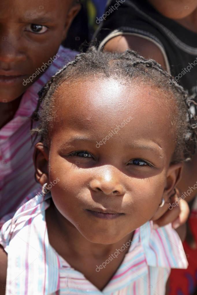 Portrait of cute Black African kid smiling to the camera, Namibi ...