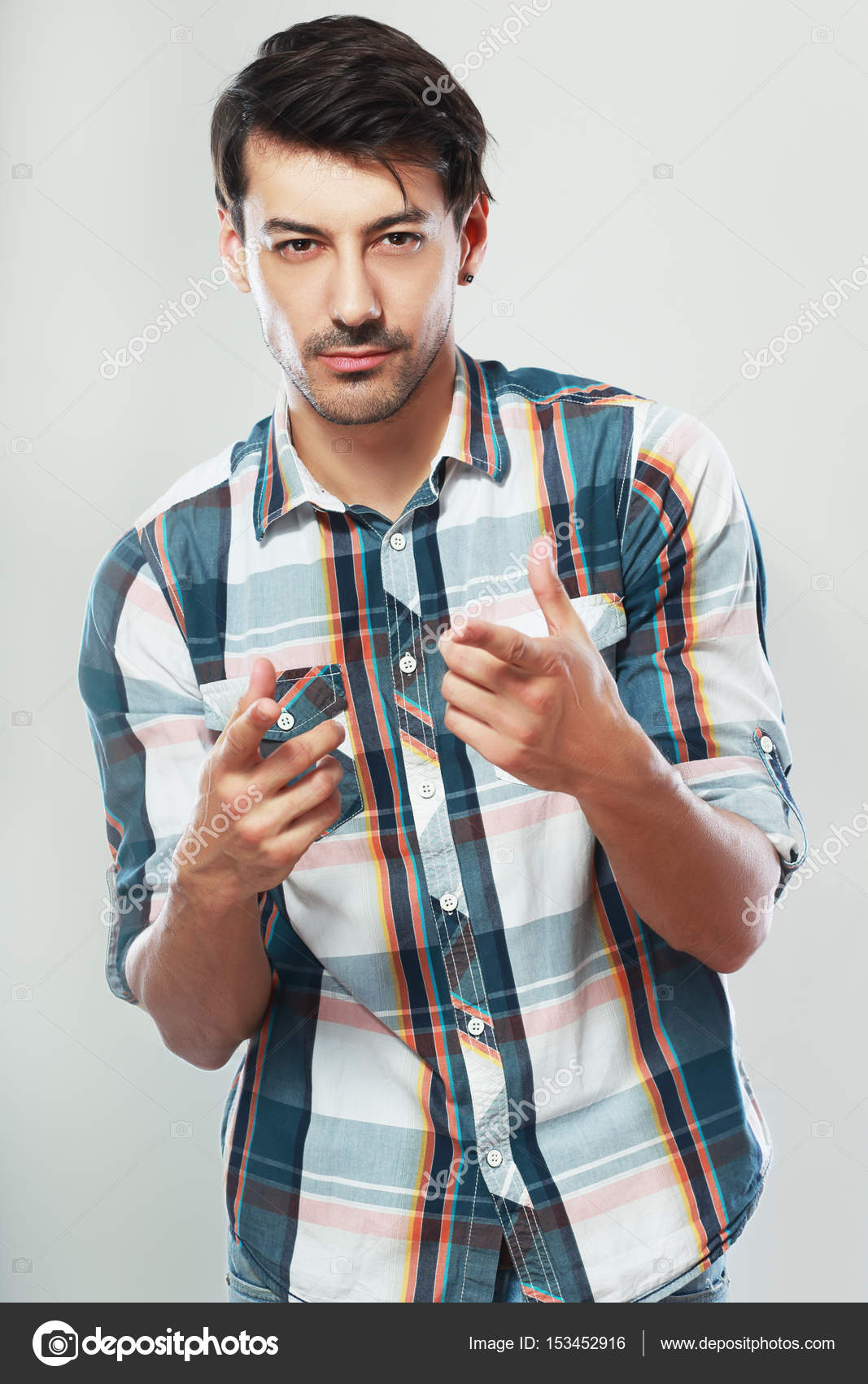 Man looking and pointing at camera — Stock Photo © lenanet #153452916