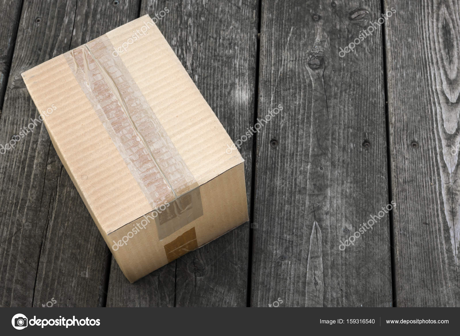 Cardboard delivery parcel box Stock Photo by ©elenathewise 159316540