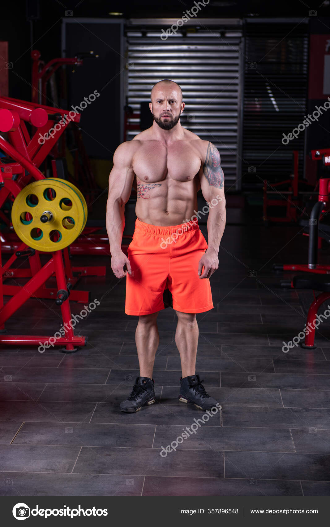 Powerful Muscular Man Posing Gym — Stock Photo © cirkoglu #357896548