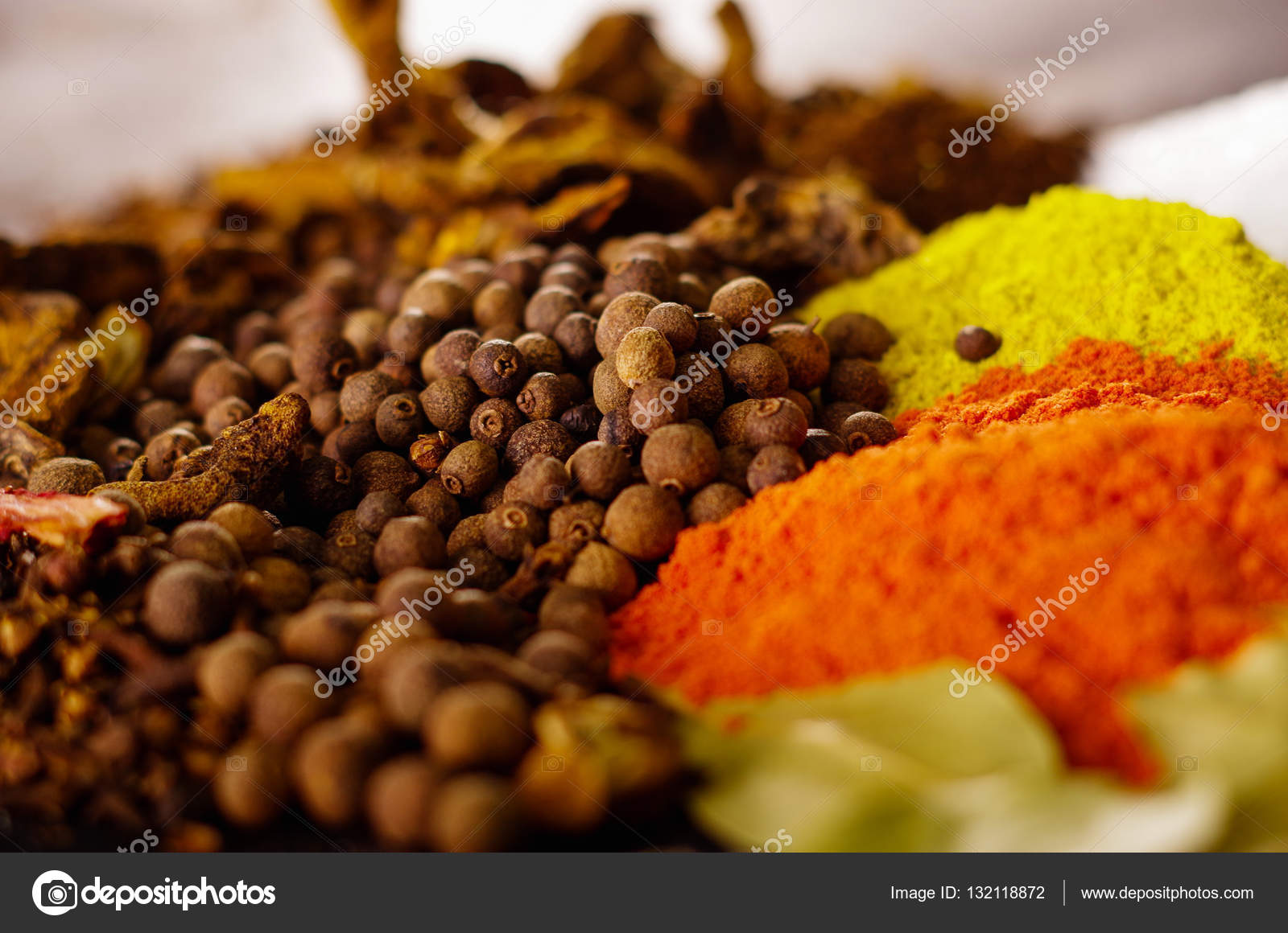 Closeup from above different piles of colorful spices, beautiful rustic ...