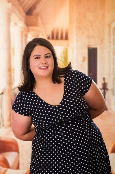 Young beautiful plus size model in blue jeans, xxl woman on gray ...