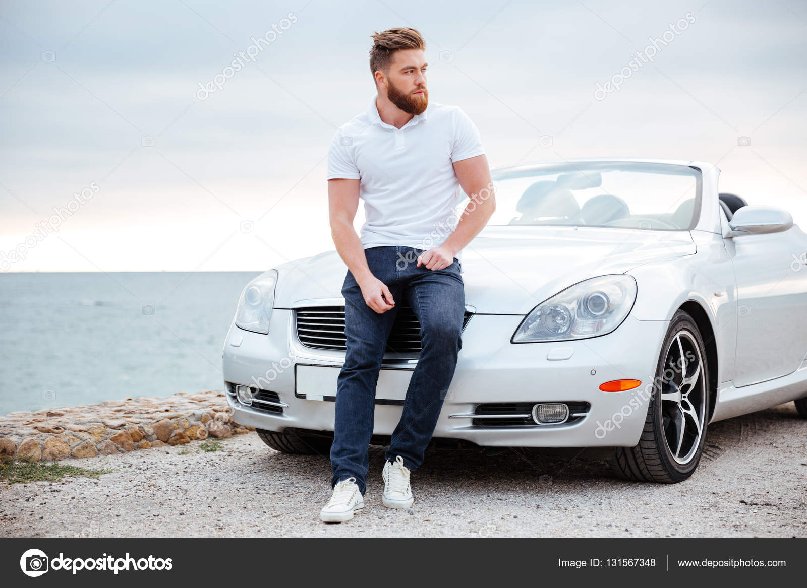 Young bearded man leaning on his car — Stock Photo © Vadymvdrobot ...