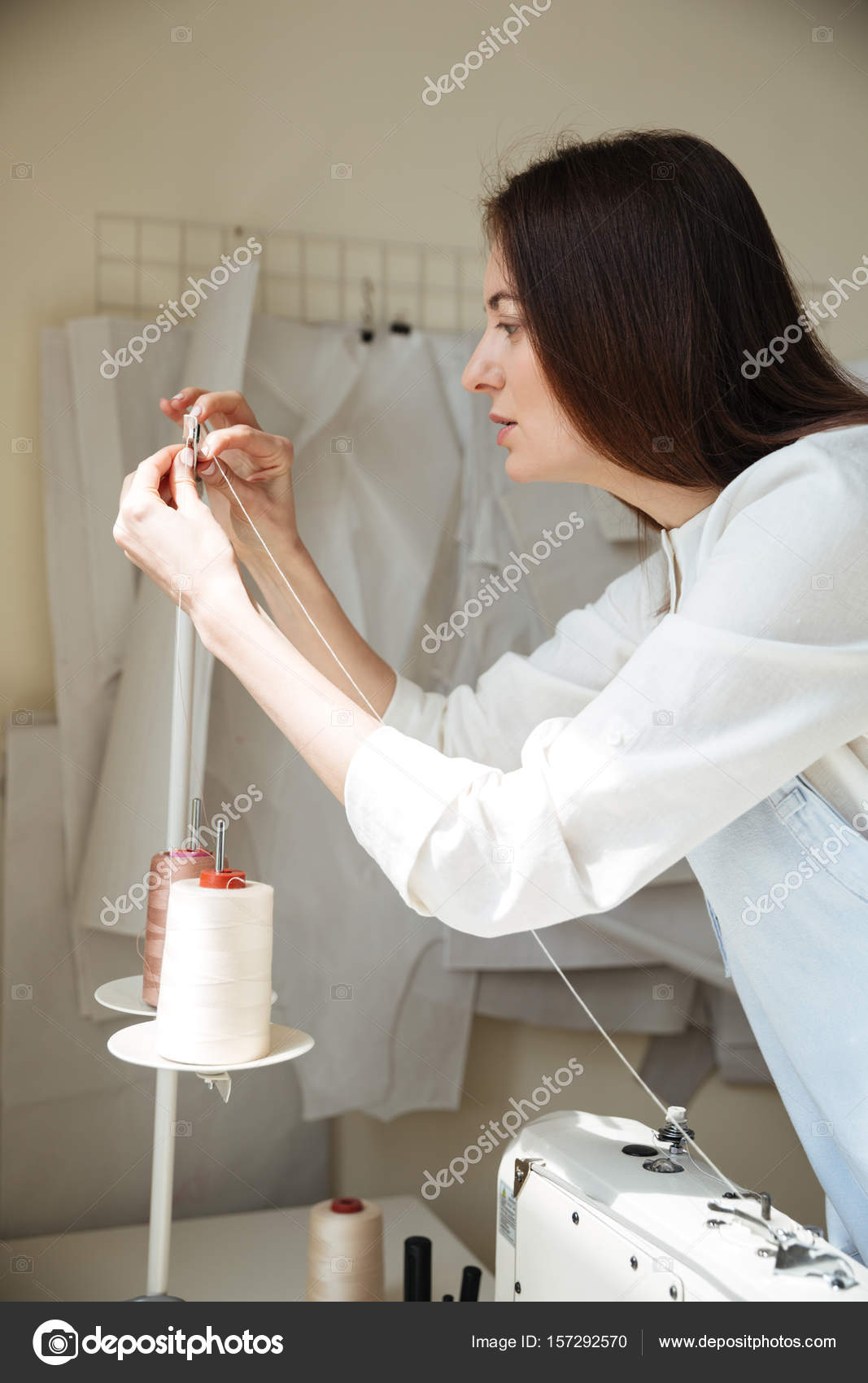 Side view of seamstress working with sewing machine — Stock Photo ...