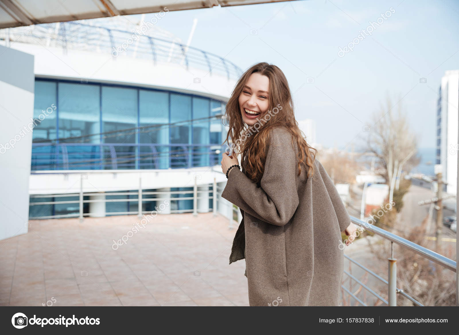 Woman laughing while walking near sea — Stock Photo © Vadymvdrobot ... Woman laughing while walking near sea — Stock Photo © Vadymvdrobot ...