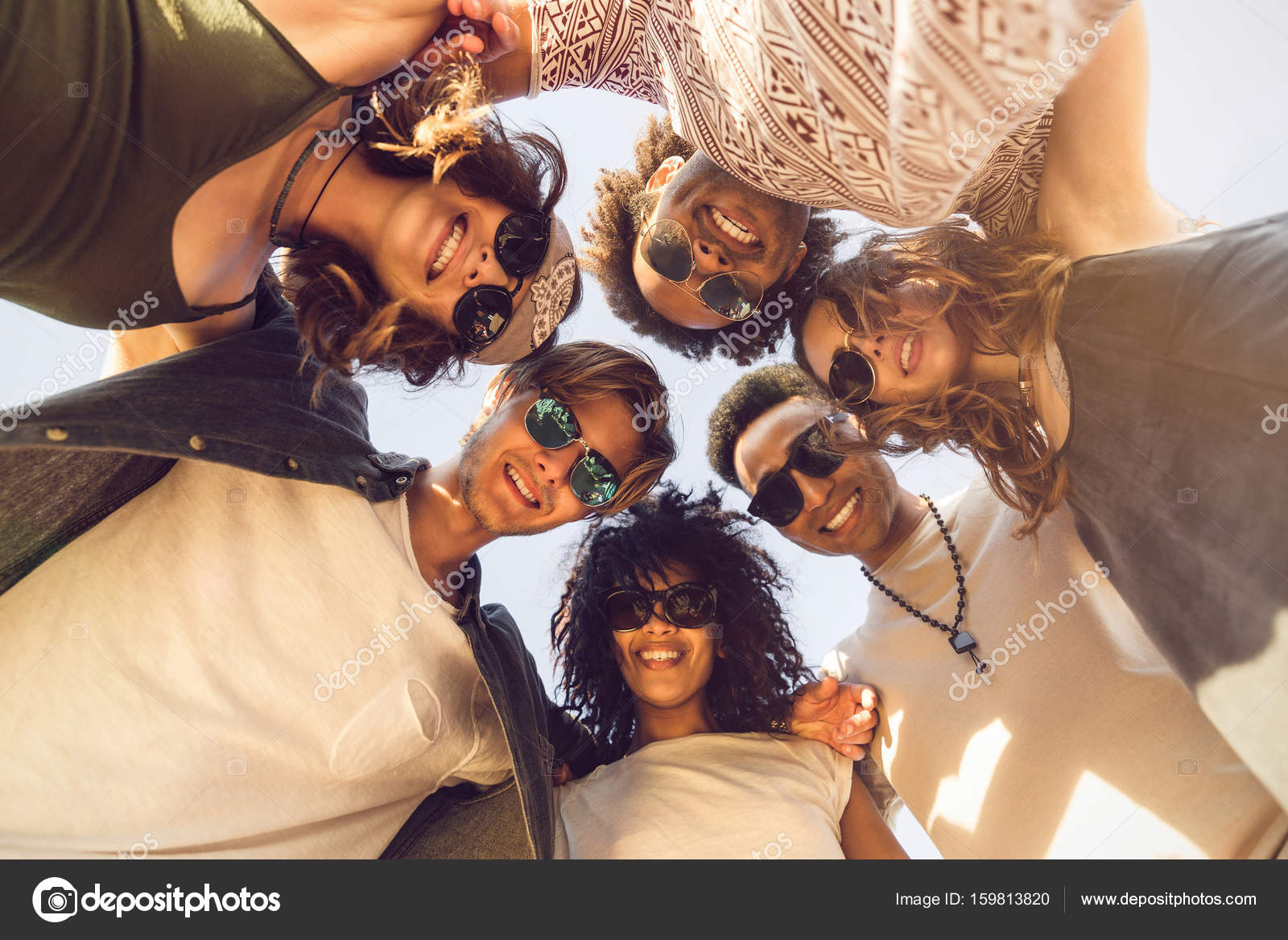 Multiethnic group of friends huddle join in a circle Stock Photo by ...