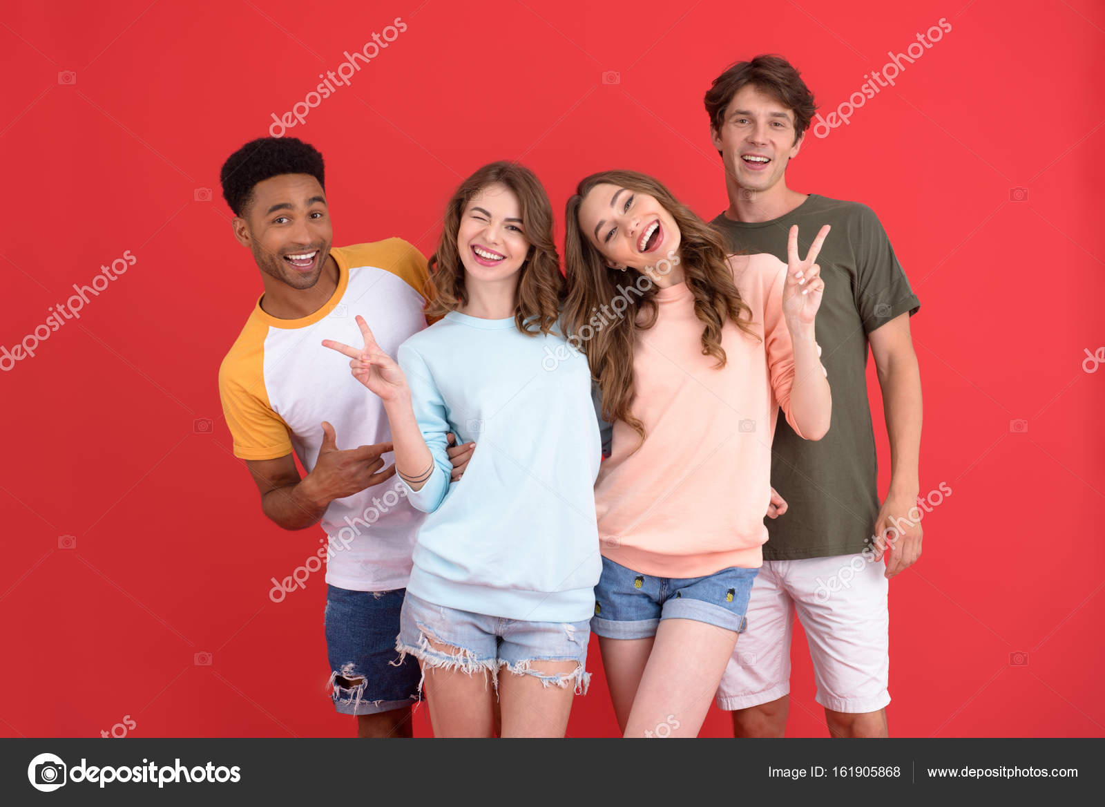 Smiling group of friends standing isolated Stock Photo by ©Vadymvdrobot ...