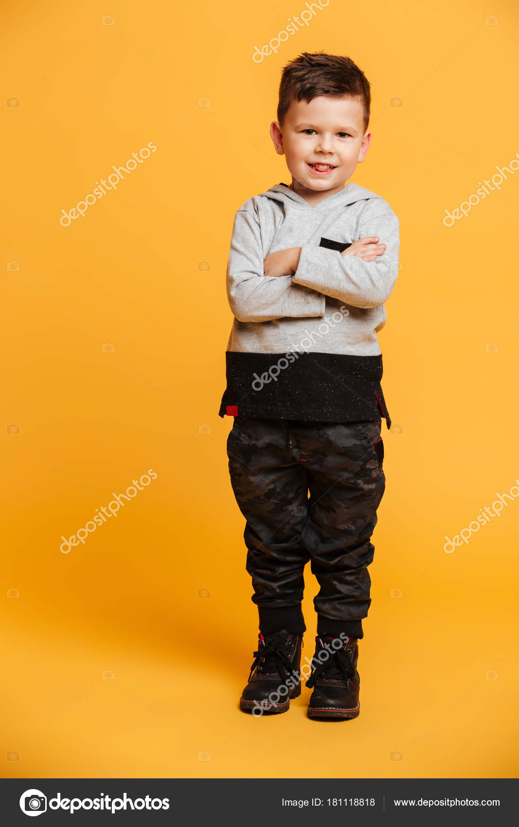Little boy child standing isolated over yellow Stock Photo by ...