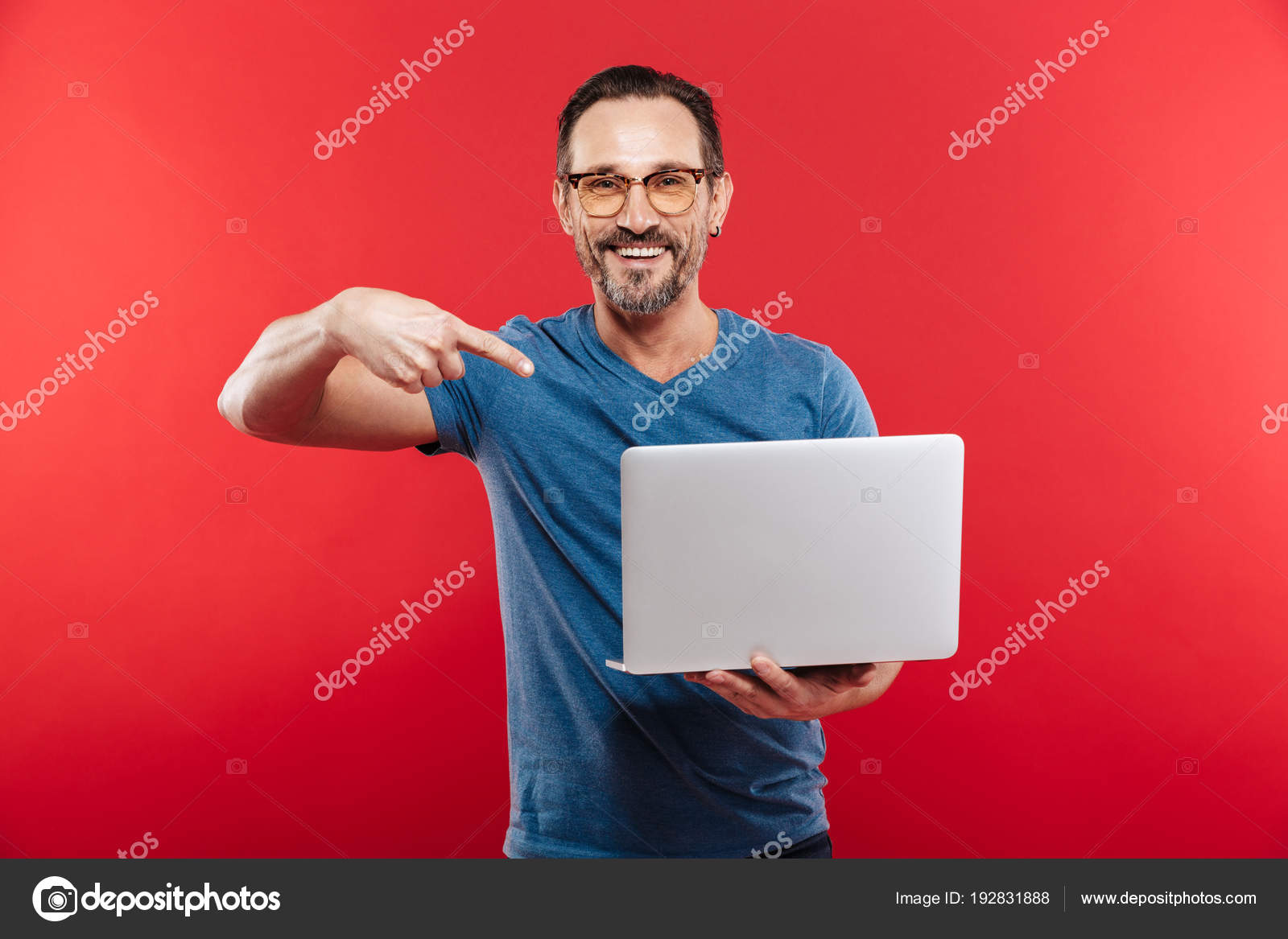 Happy emotional positive man using laptop computer. Stock Photo by ...