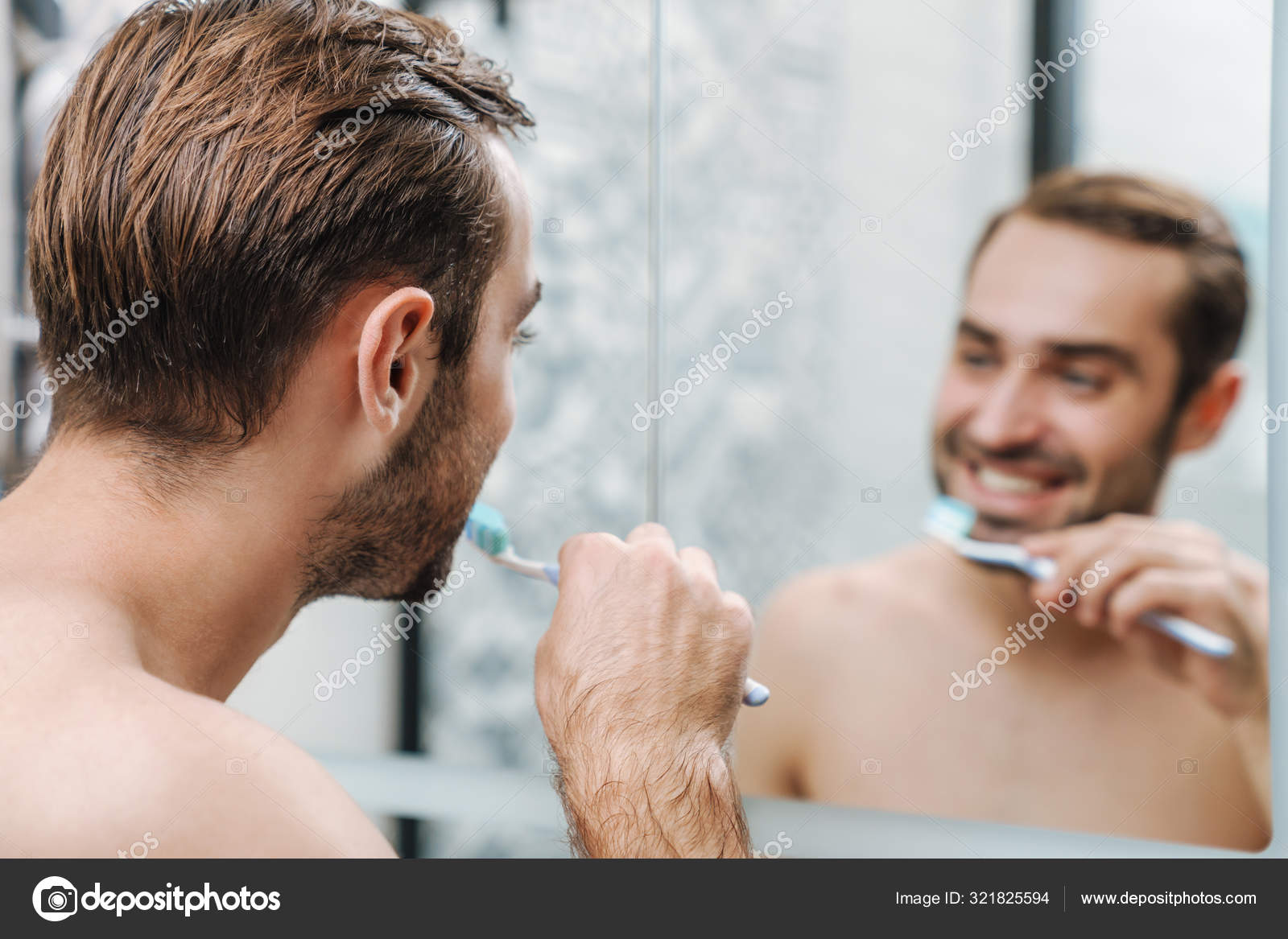 Attractive smiling shirtless man brushing teeth Stock Photo by ...