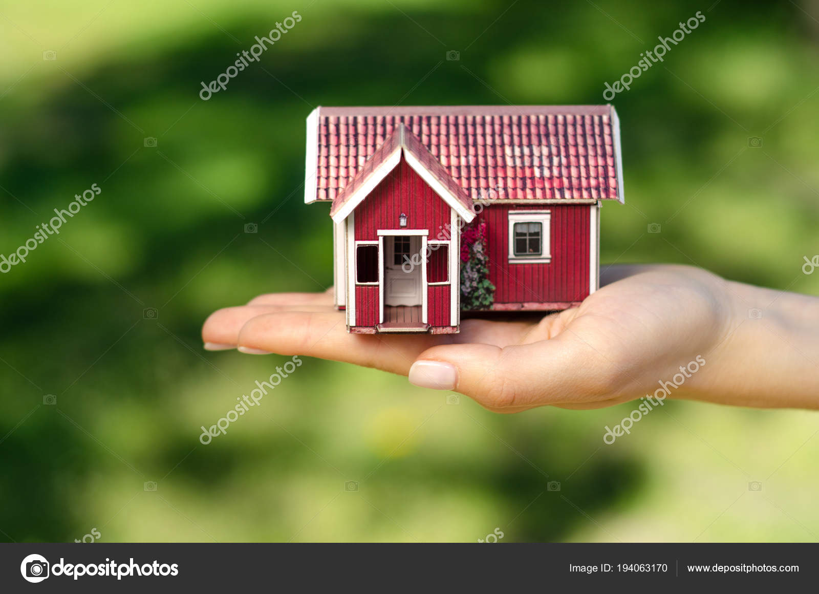 Small house in hand sun green garden nature — Stock Photo © Evgenyjs1 ...