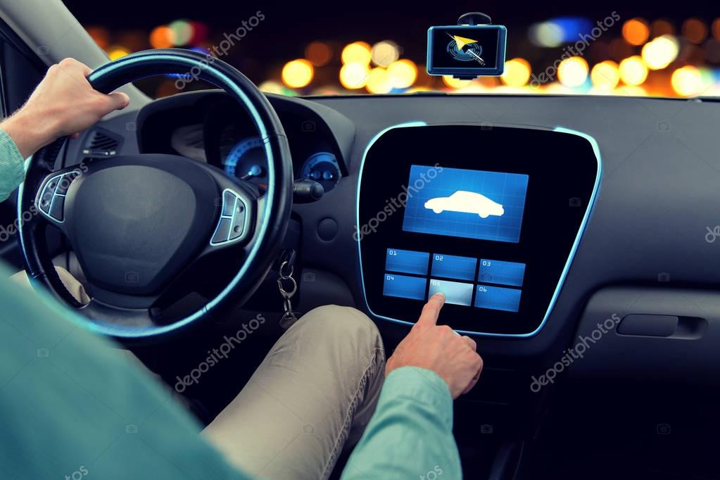 Close up of man driving car with on board computer — Stock Photo © Syda ...