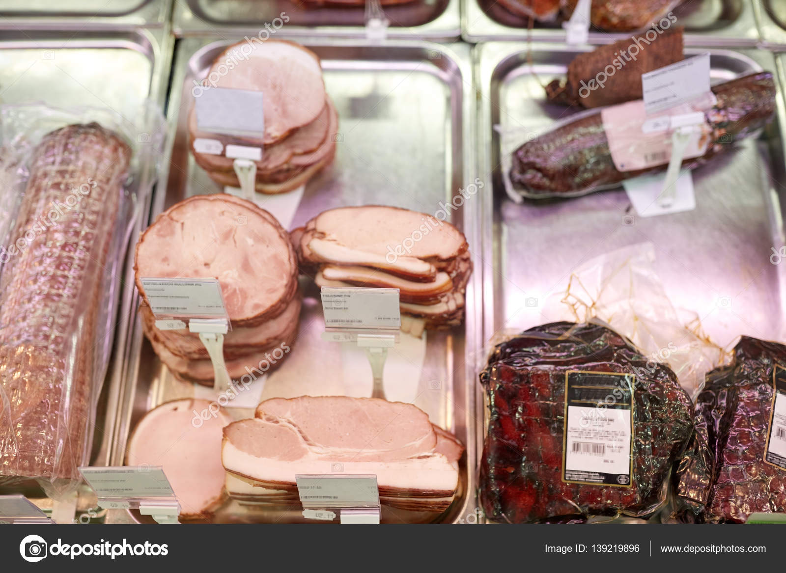 Ham at grocery store stall Stock Photo by ©Syda_Productions 139219896