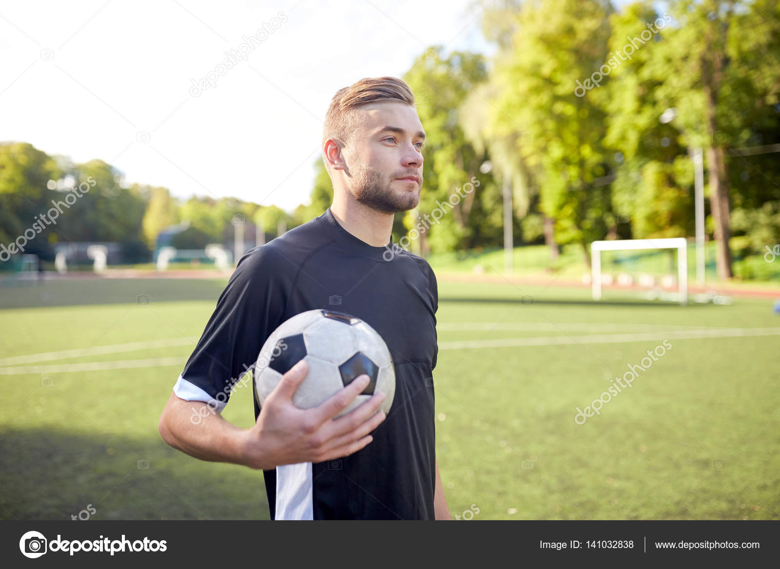 Soccer player with ball on football field Stock Photo by ©Syda ...