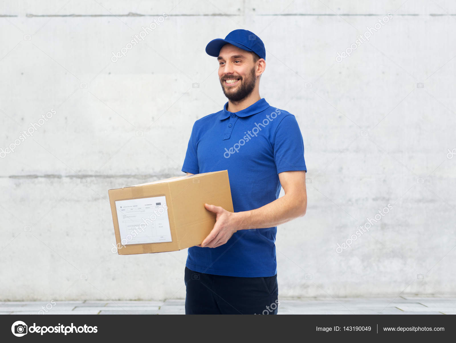 Happy delivery man with parcel box — Stock Photo © Syda_Productions ...