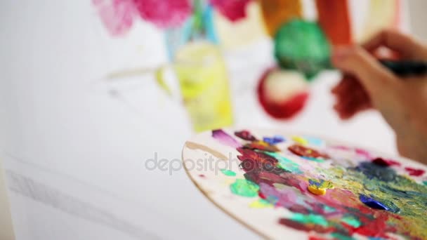 Artist woman with paint palette. Stock Photo by ©poznyakov 26316923
