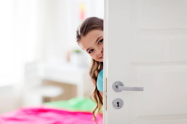 Happy smiling beautiful girl behind door at home Stock Photo by ©Syda ...
