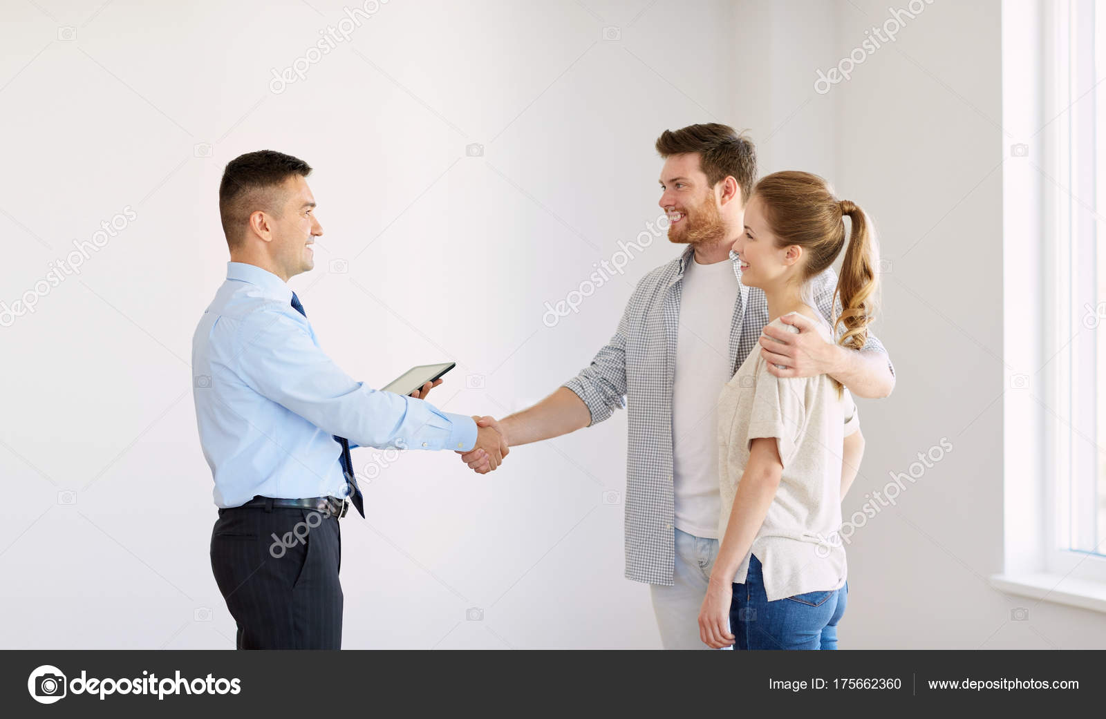 Man and realtor shaking hands at new home — Stock Photo © Syda ...
