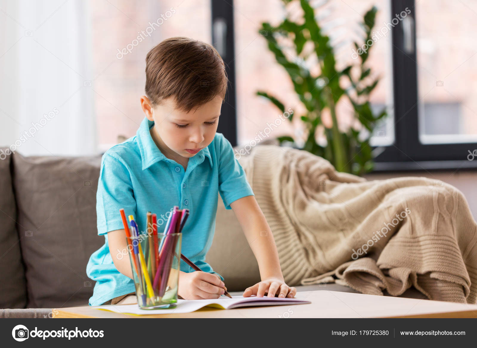 Boy with notebook and pencils drawing at home Stock Photo by ©Syda ...