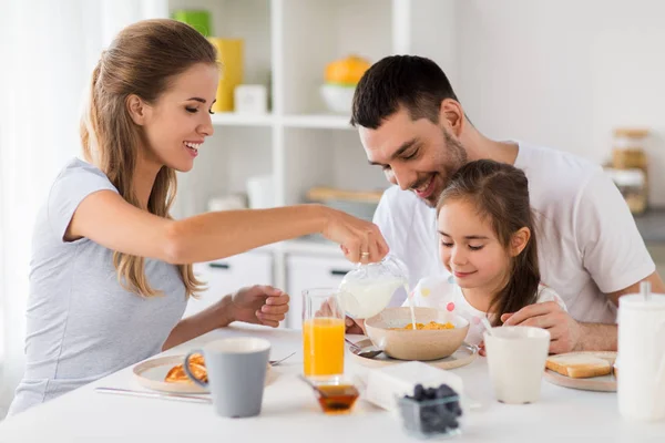happy family having breakfast at home - Stock Image - Everypixel