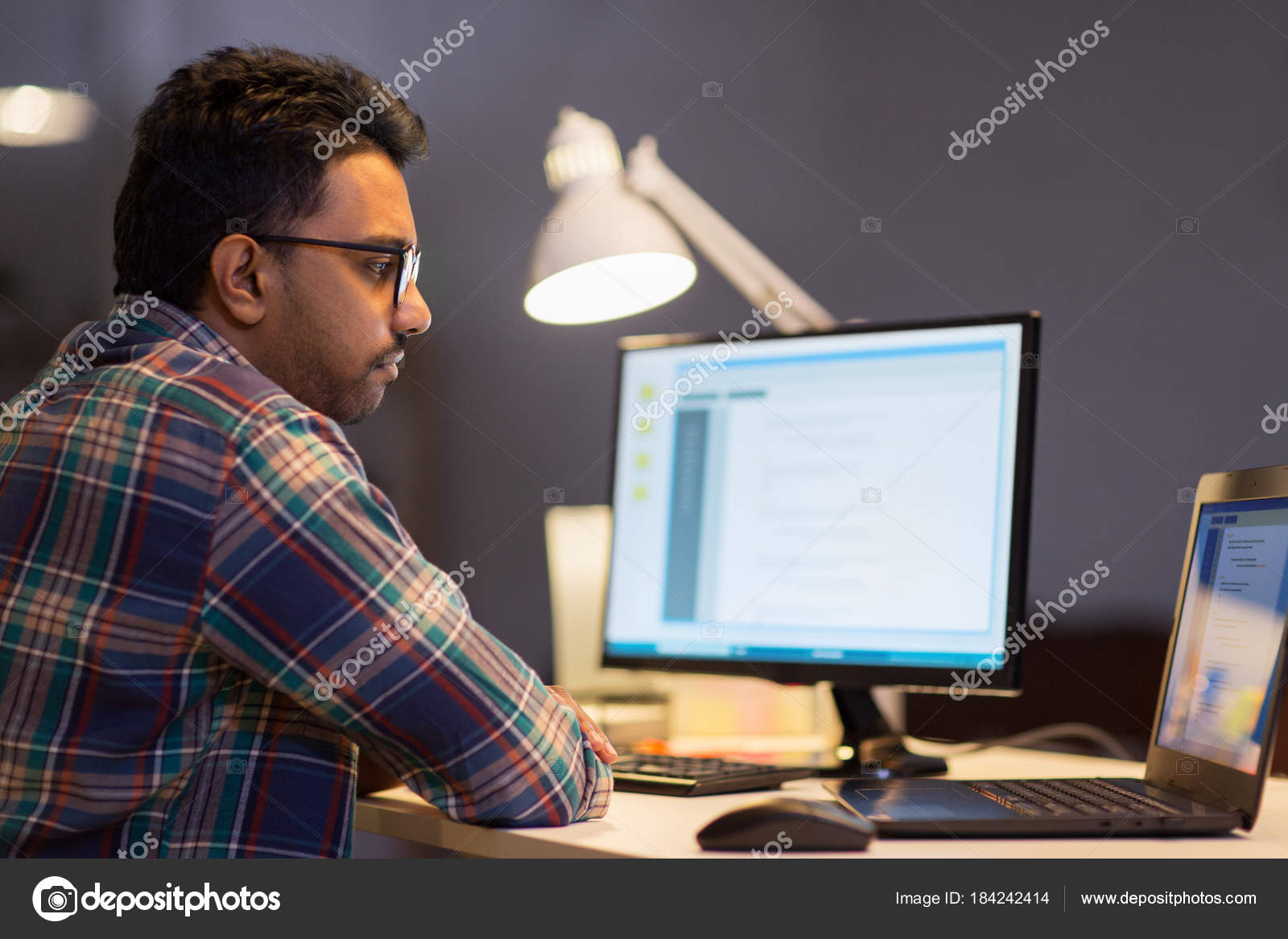 Creative man working with laptop at night office ⬇ Stock Photo, Image ...