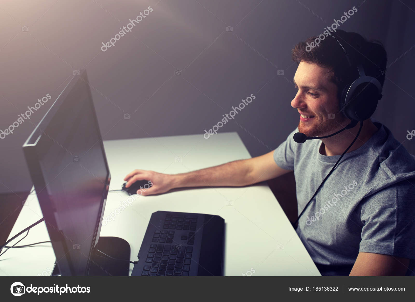 Man in headset playing computer video game at home — Stock Photo © Syda ...