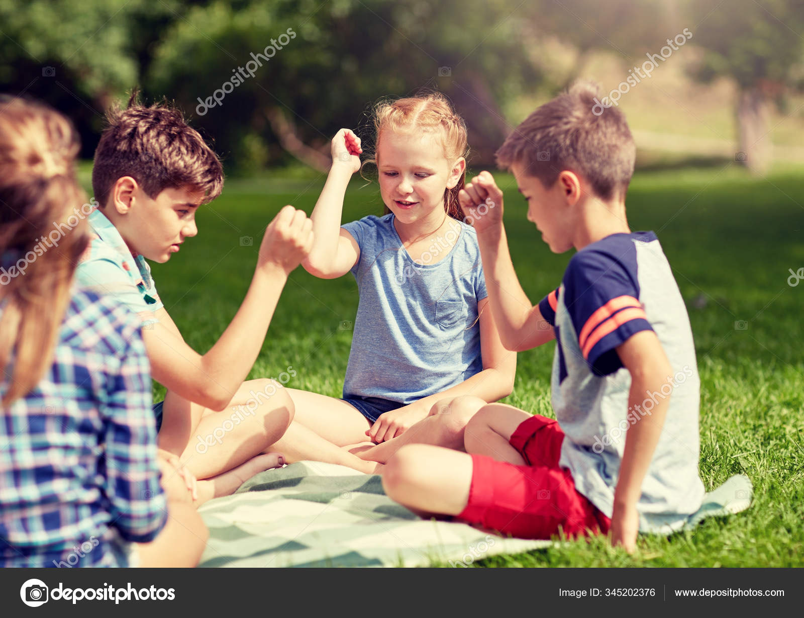 Happy kids playing rock-paper-scissors game Stock Photo by ©Syda ...