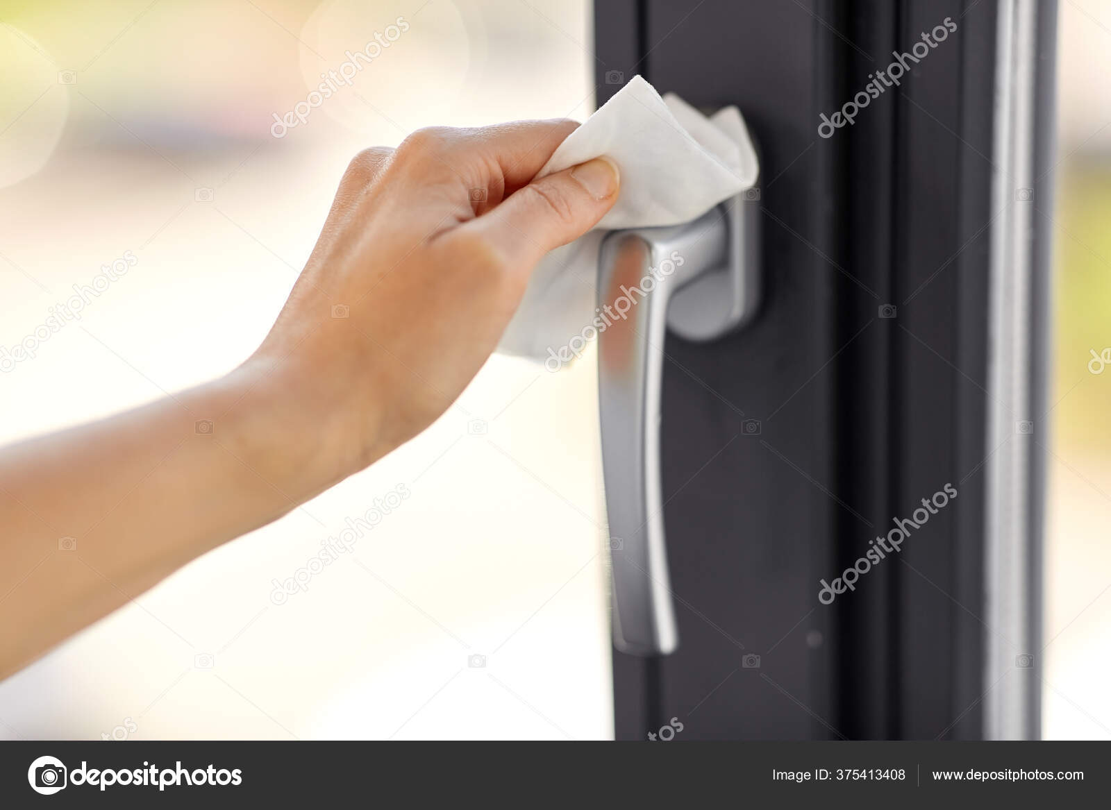 Woman cleaning window handle with wet wipe Stock Photo by ©Syda ...