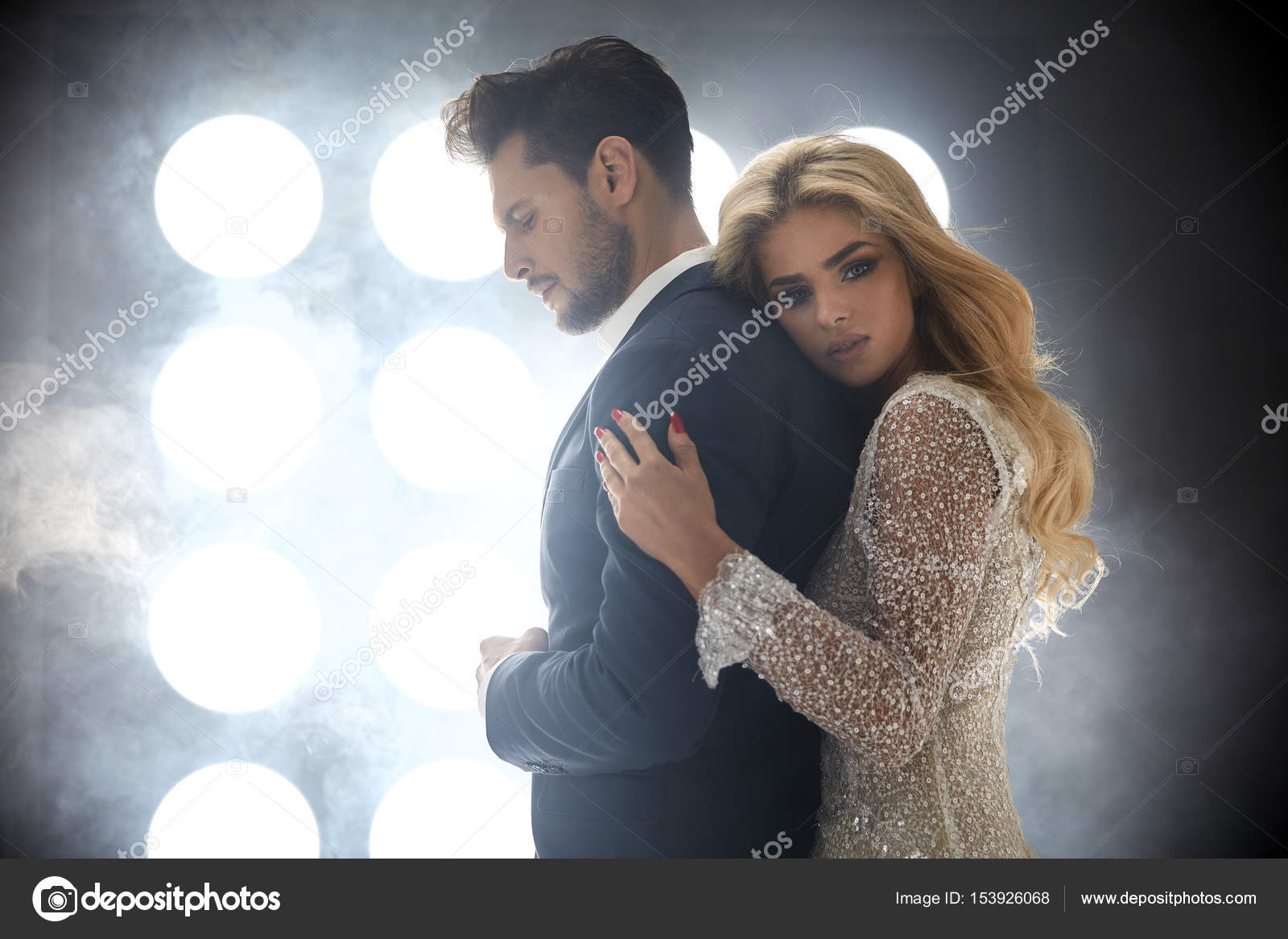 Adorable blond lady hugging a handsome guy Stock Photo by ©konradbak ...