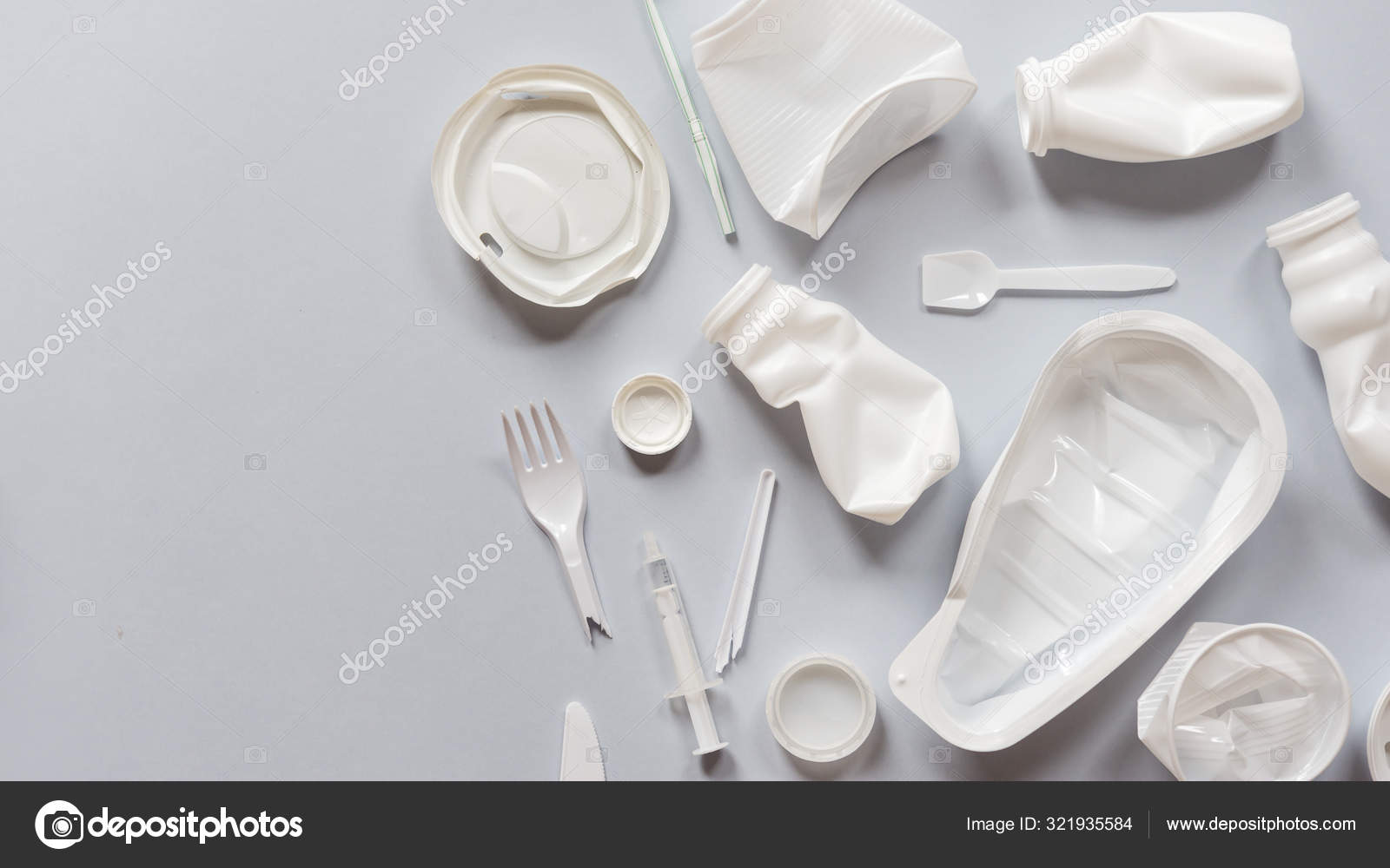 Used white plastic packaging for food on a gray background Stock Photo ...
