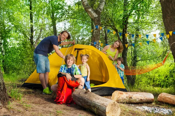 Young active family camping in forest - Stock Image - Everypixel