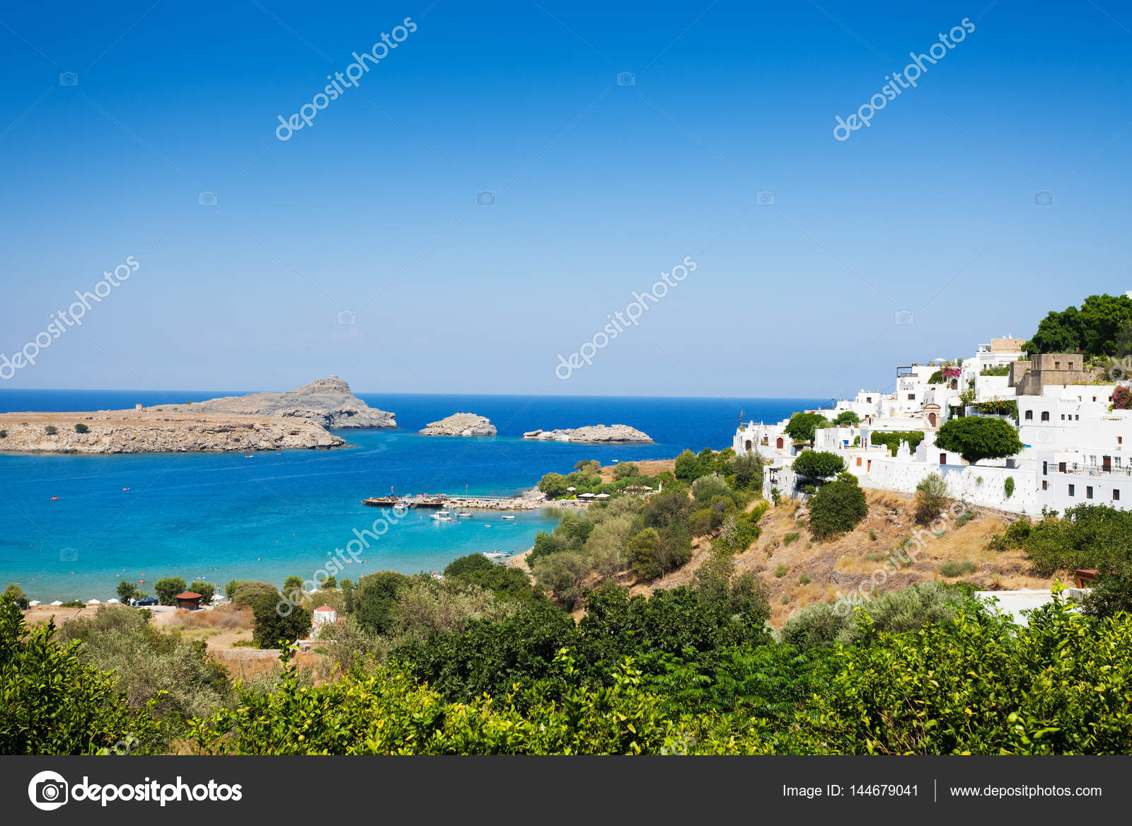 Lindos bay and blue Aegean sea Stock Photo by ©serrnovik 144679041