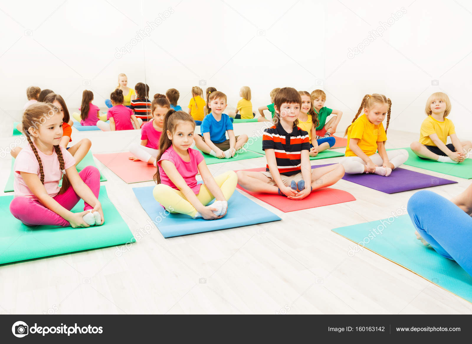 Happy kids practicing gymnastic — Stock Photo © serrnovik #160163142