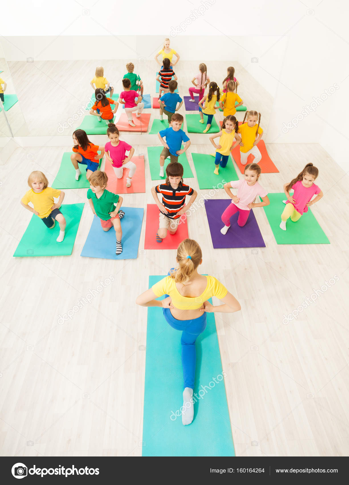 Happy kids practicing gymnastic — Stock Photo © serrnovik #160164264
