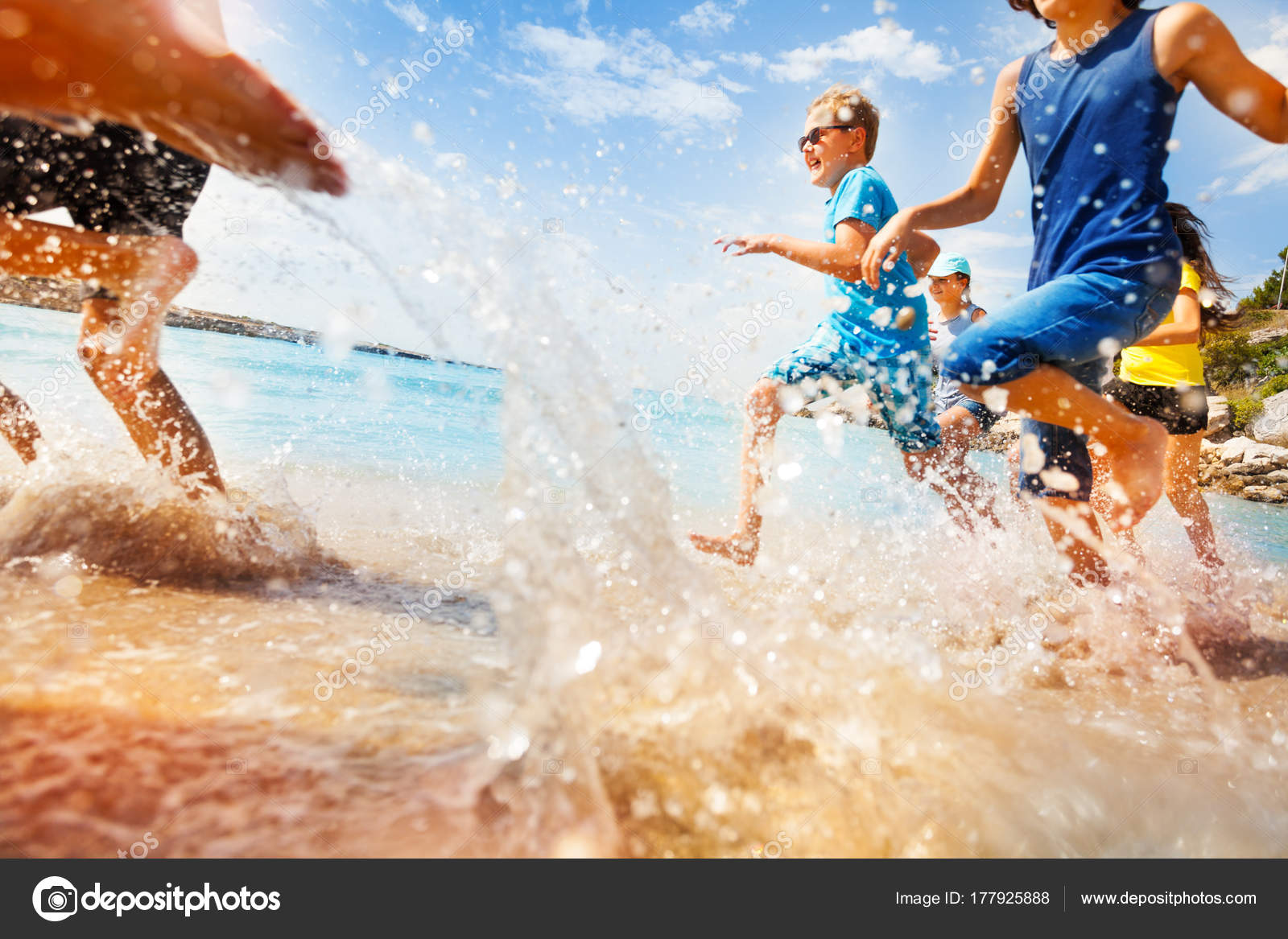 Group Kids Running Shallow Sea Water Making Splashes Summer Sunny Stock ...