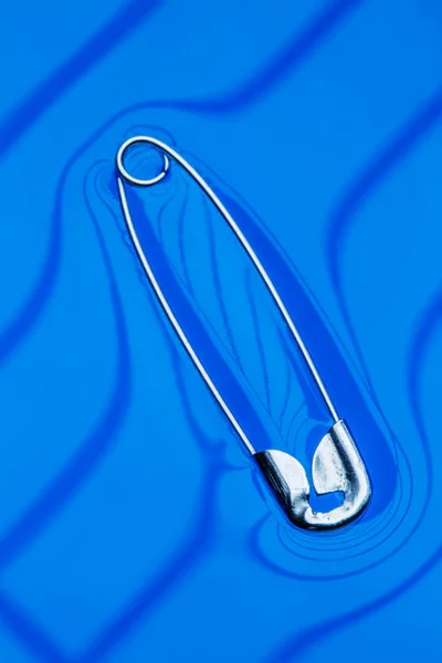 Physical experiment - pin floating on water surface. Stock Photo by ...